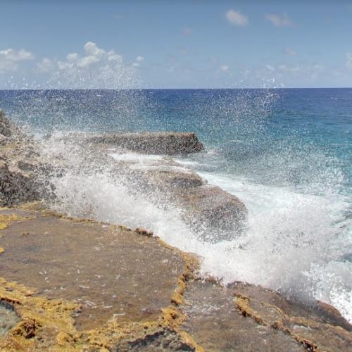 Ocean spray in Sinapalu, Northern Mariana Islands - Virtual Globetrotting