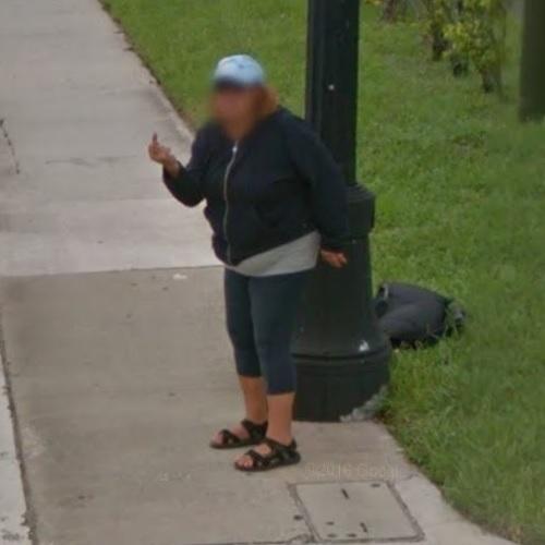 Woman showing Middle finger in Hallandale Beach, FL (Google Maps)