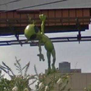 Alien hanging from billboard in Tallahassee, FL - Virtual Globetrotting
