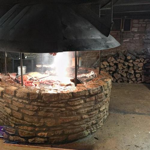 Open barbecue pit at The Salt Lick Bar-B-Que in Driftwood, TX (Google Maps)