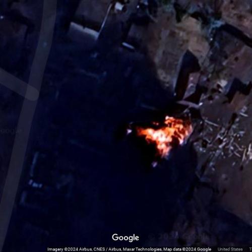 Burning building in Hostomel, Ukraine (Google Maps)