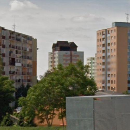 Traditional village houses on top of a commie block in Kosice, Slovakia ...