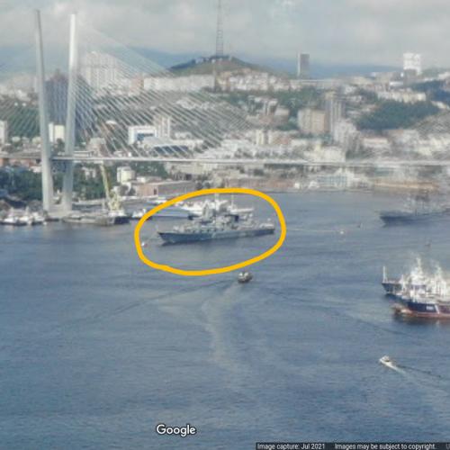 Slava-class cruiser under tow in Vladivostok, Russian Federation ...