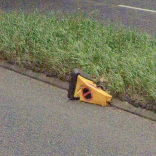 Broken sign in the middle of the road in Cirencester, United Kingdom ...