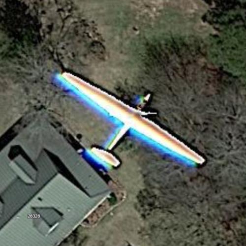 Glider flying over a house in Waller, TX (Google Maps)