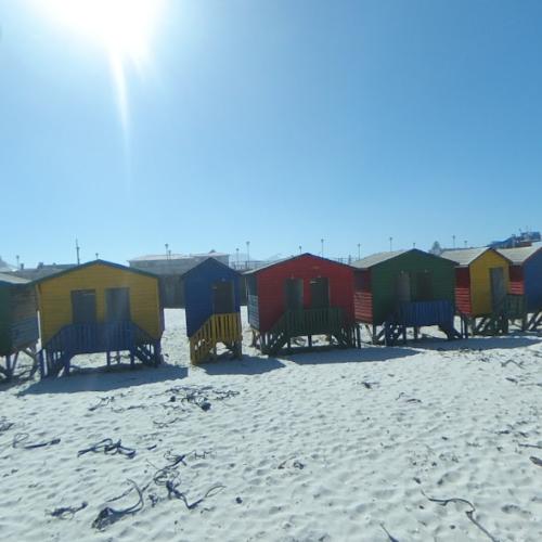 The historic beach changing huts on Muizenberg Beach in Muizenberg ...